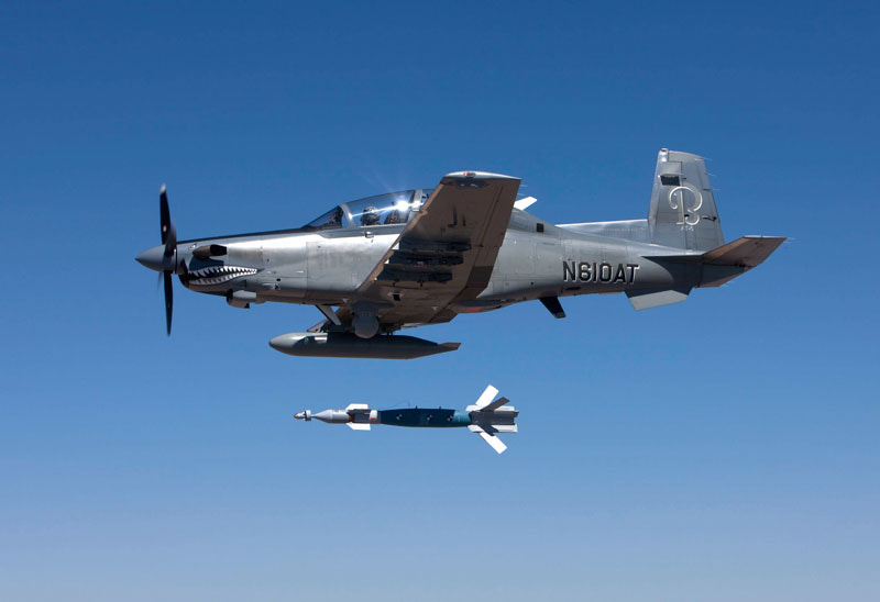 AT-6 Scores Hits with Laser-Guided Bombs | Aviation International News